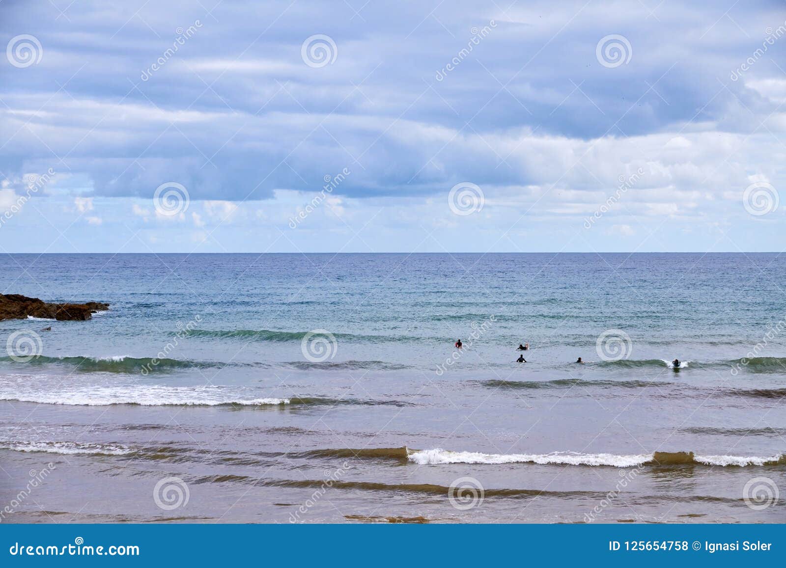 Some people doing surf stock photo. Image of coastline - 125654758