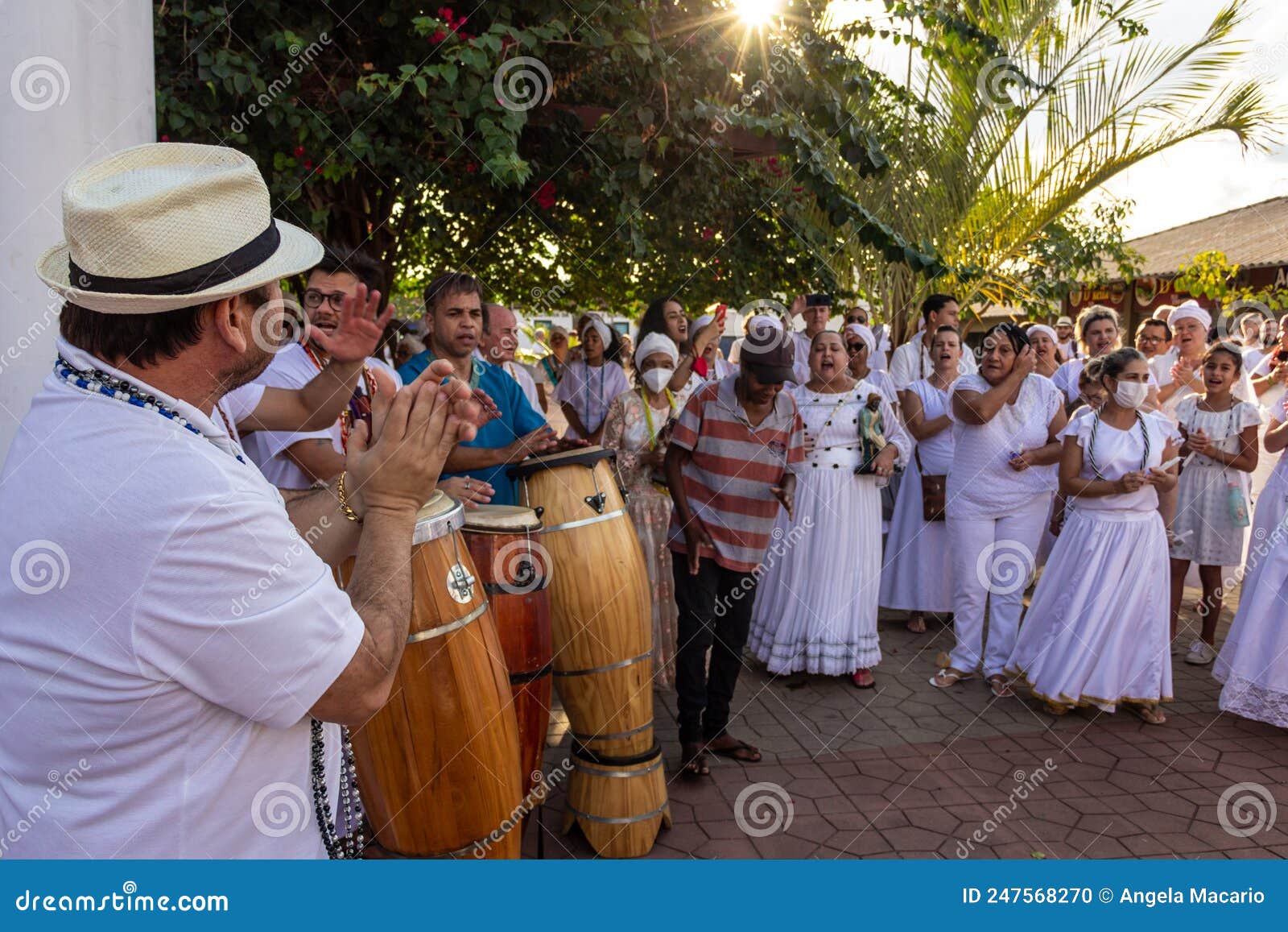 Some People Singing, Dancing and Playing Percussion Instruments ...