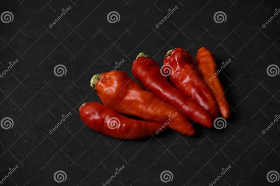 Some Red Chillies on the Dark Table Stock Image - Image of chilly ...