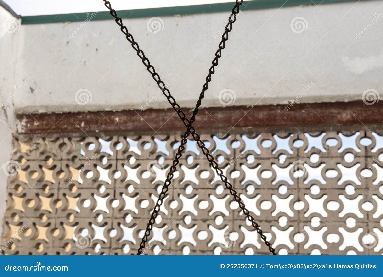 Some Rusty Chains Forming a Cross with a Cement Lattice with White ...