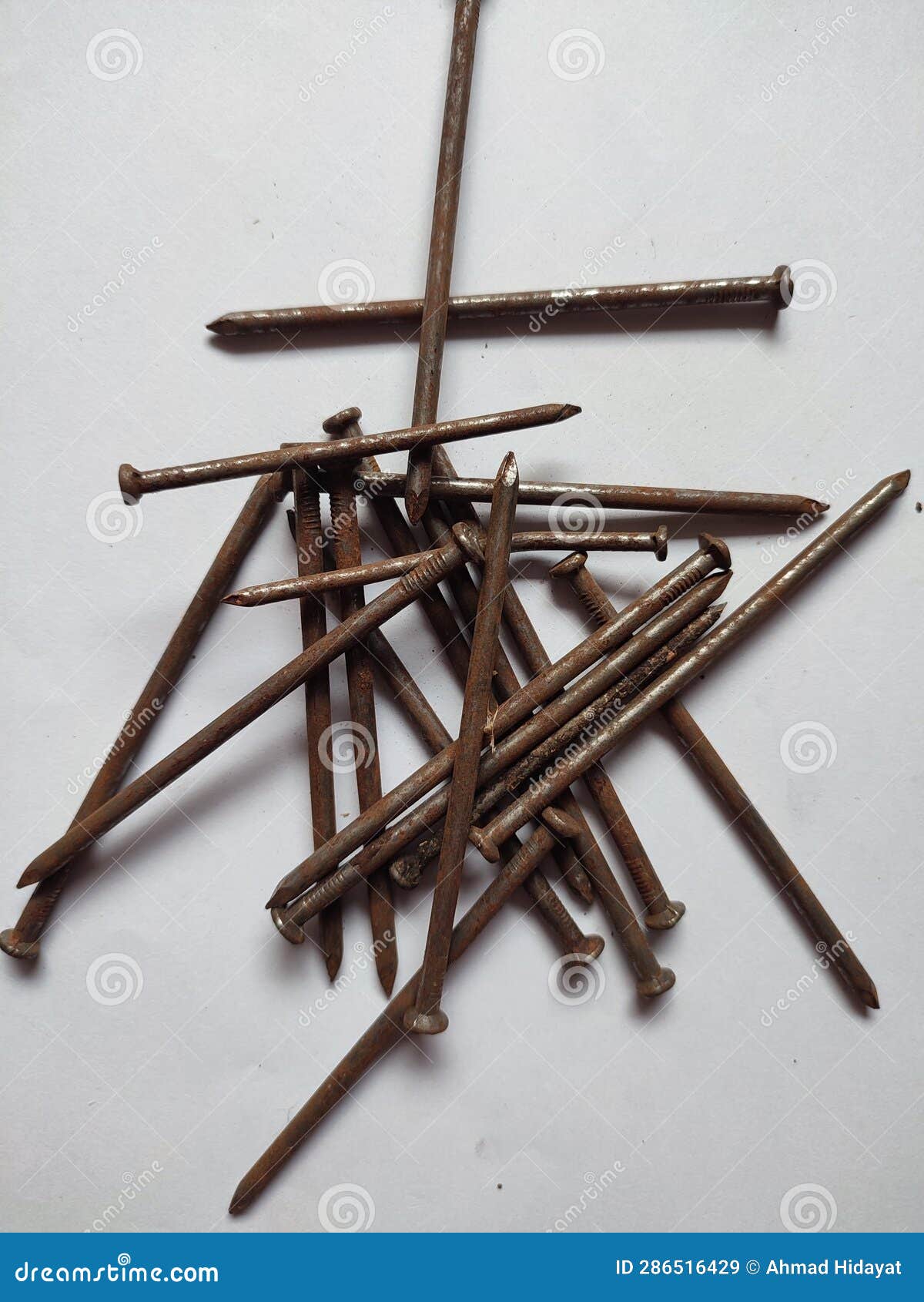 Some Scattered Rusty Nails on a White Background Stock Image - Image of ...