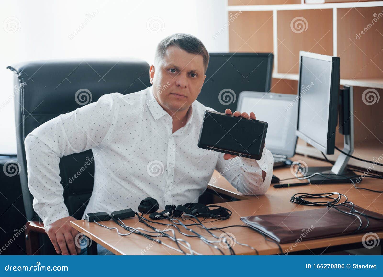 Some Serious Devices. Polygraph Examiner Works in the Office with His ...