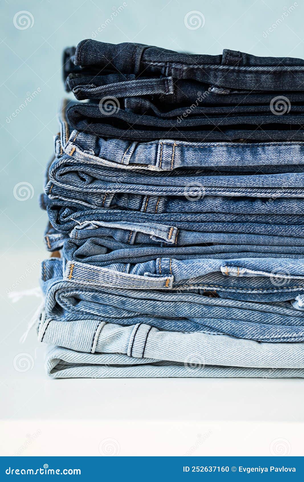 Some Stacked Blue Jeans, Close Up. Denim Collection Stock Photo - Image ...