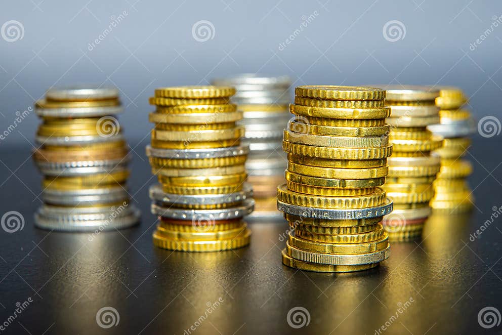 Euro coins on dark table stock photo. Image of expense - 180141600