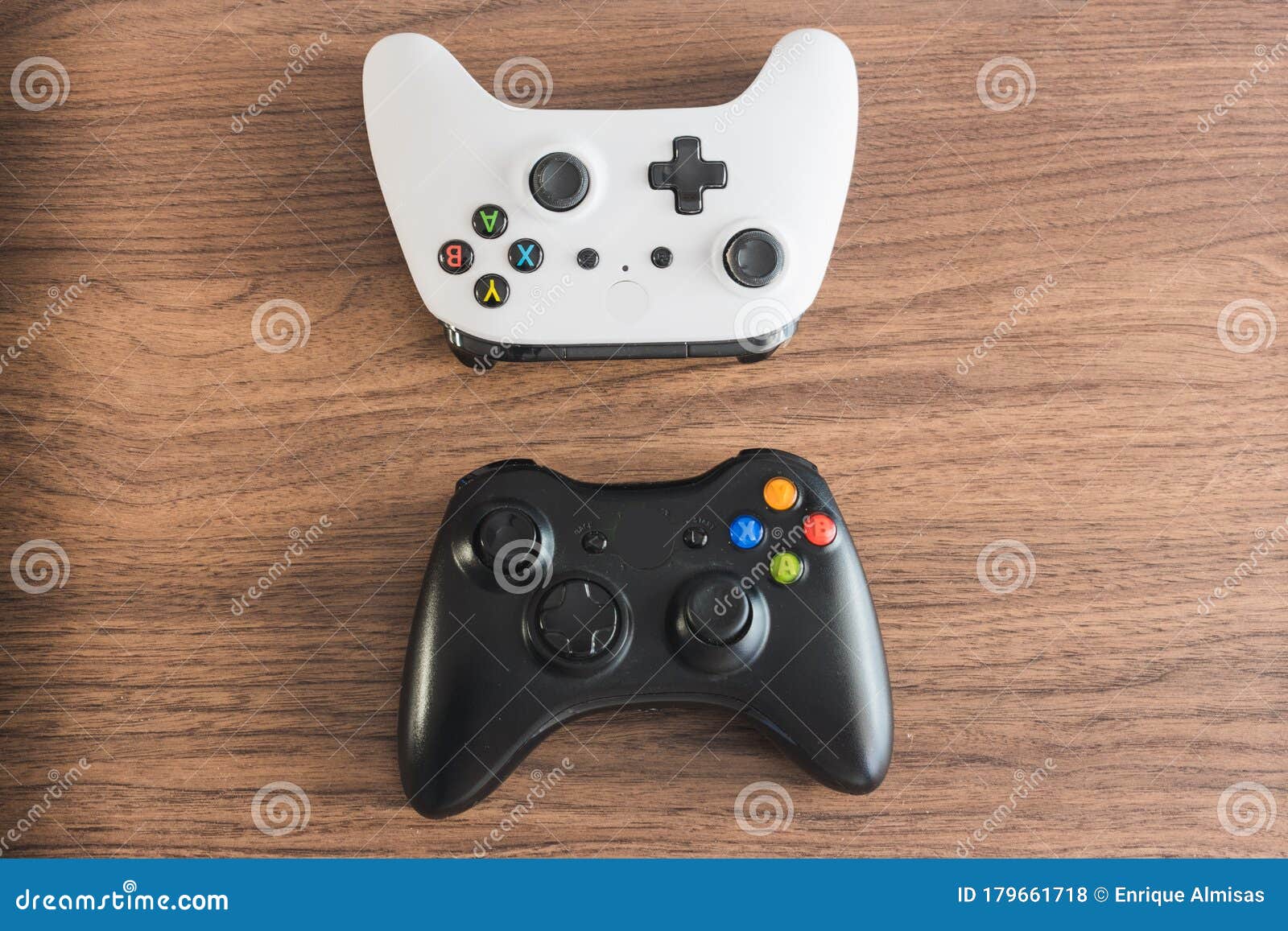 Some Video Game Controllers on a Wooden Table Stock Photo - Image of ...