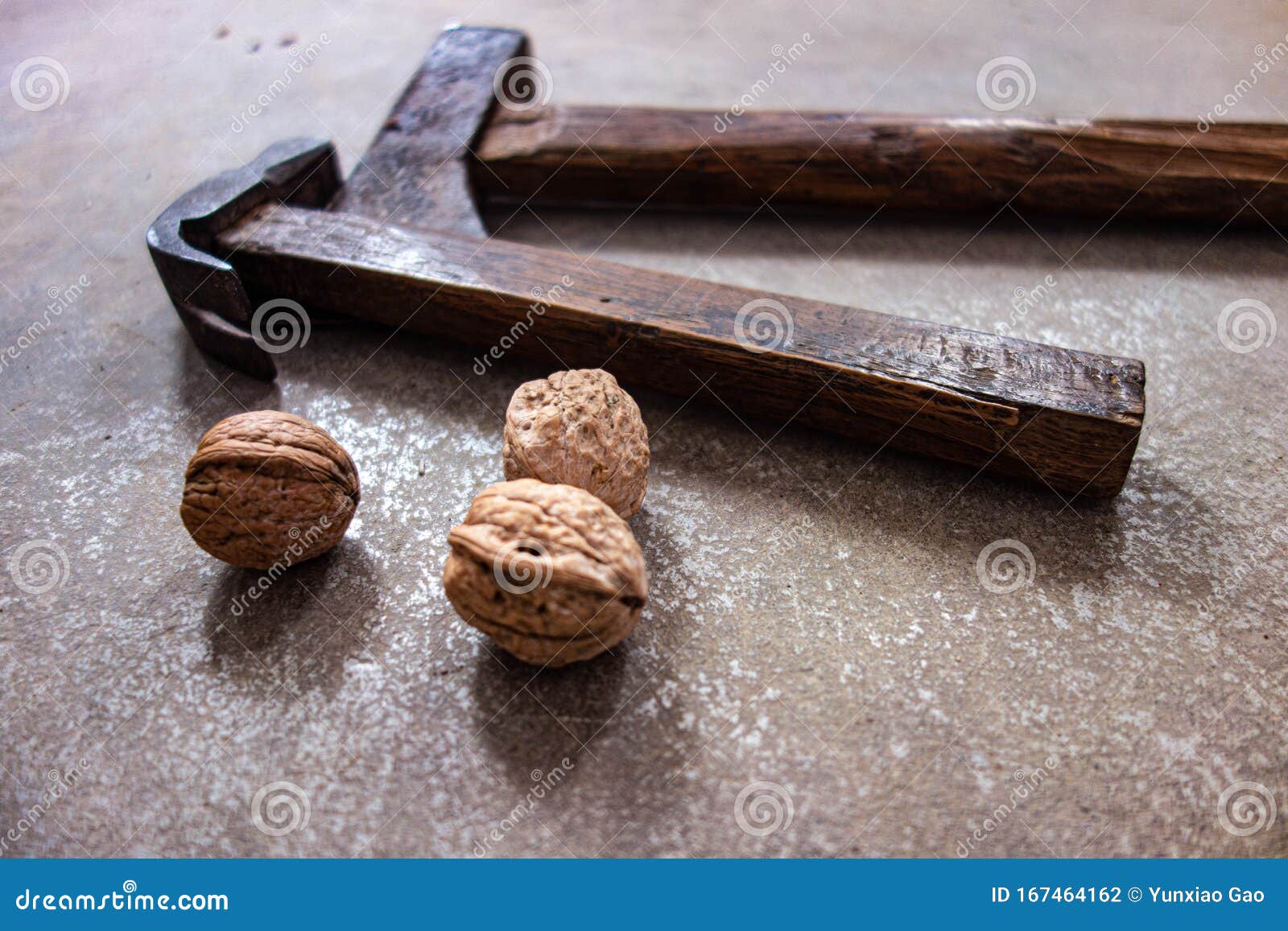 Some Walnuts Put Together with Two Old Hammers on Cement Floor Stock ...