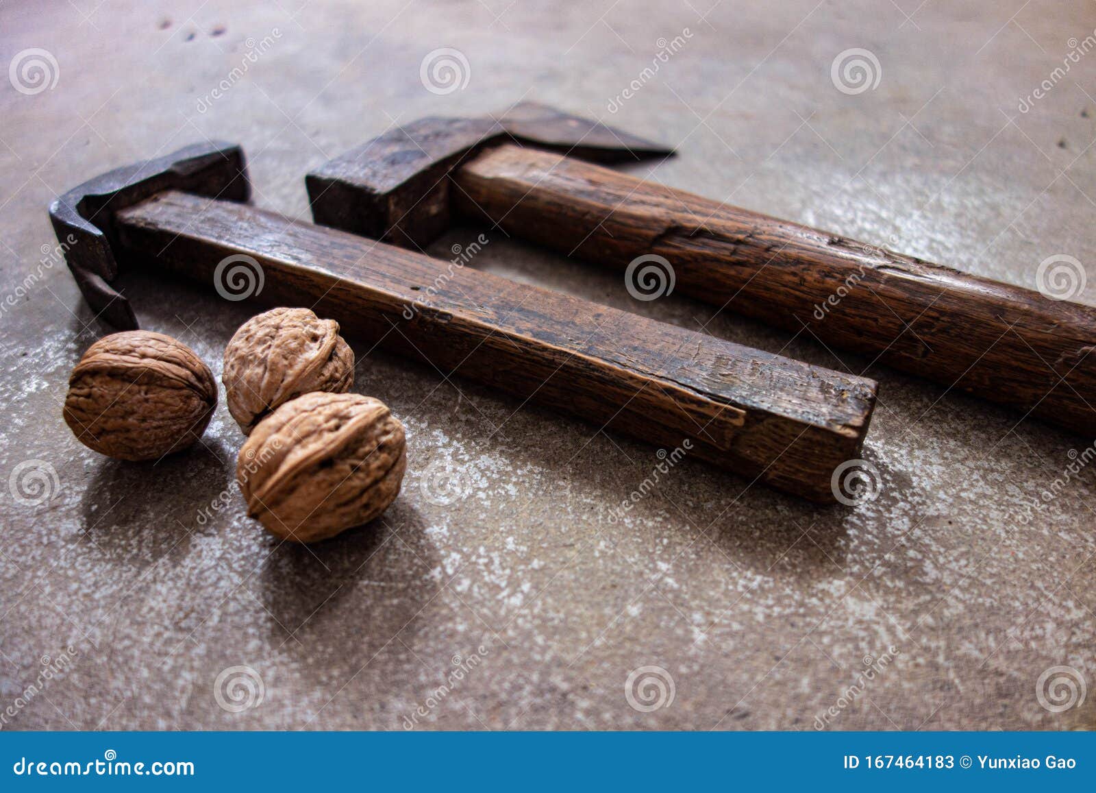 Some Walnuts Put Together with Two Old Hammers on Cement Floor Stock ...