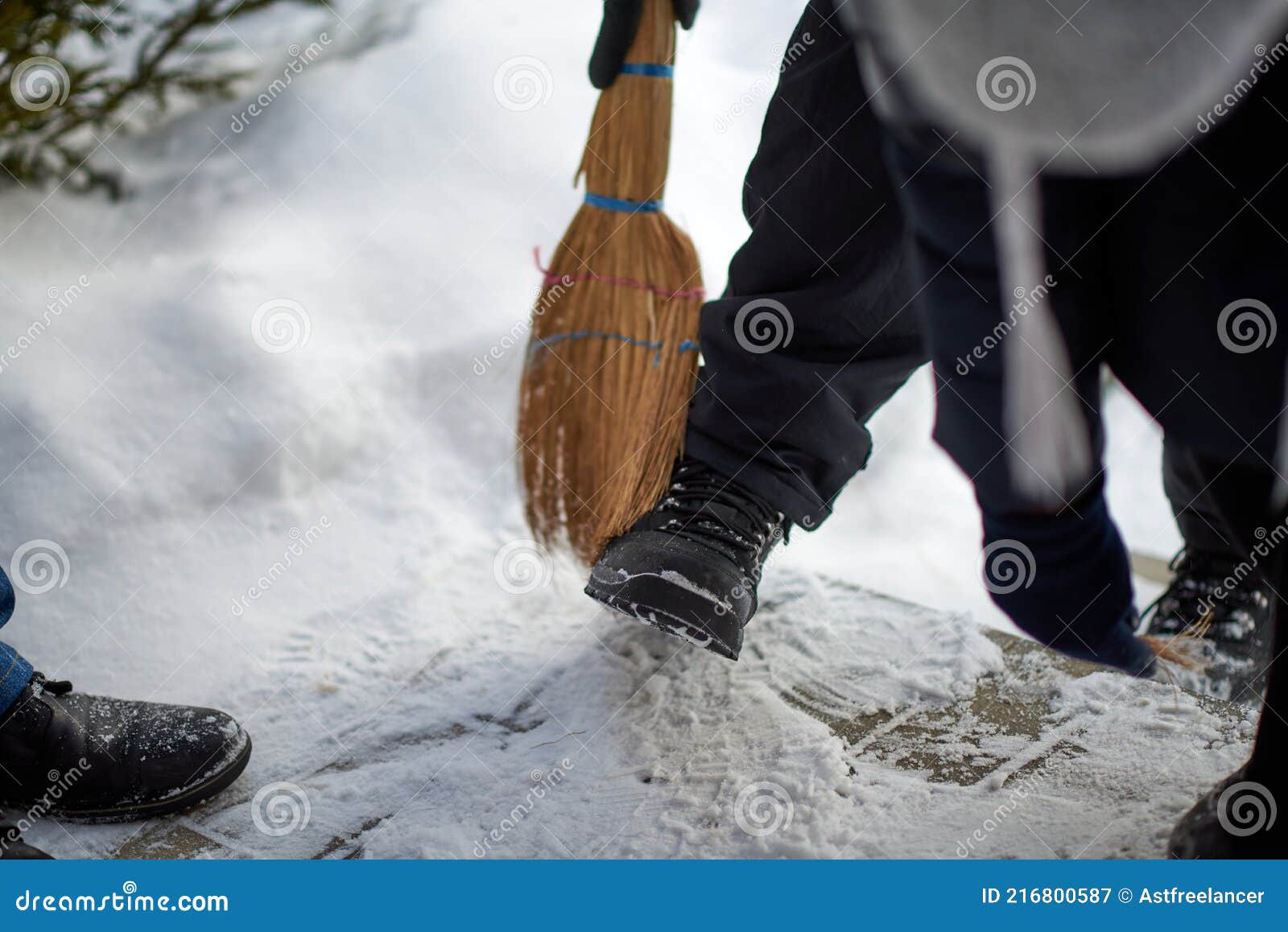 Someone is Brushing Snow from Boots with a Broom Stock Image - Image of ...