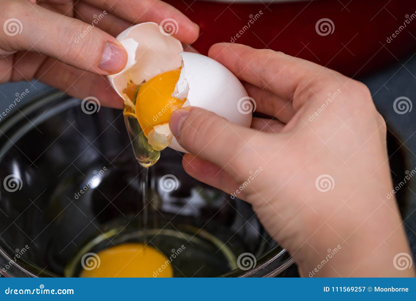 Cracking an Egg stock image. Image of pouring, cooking - 111569257