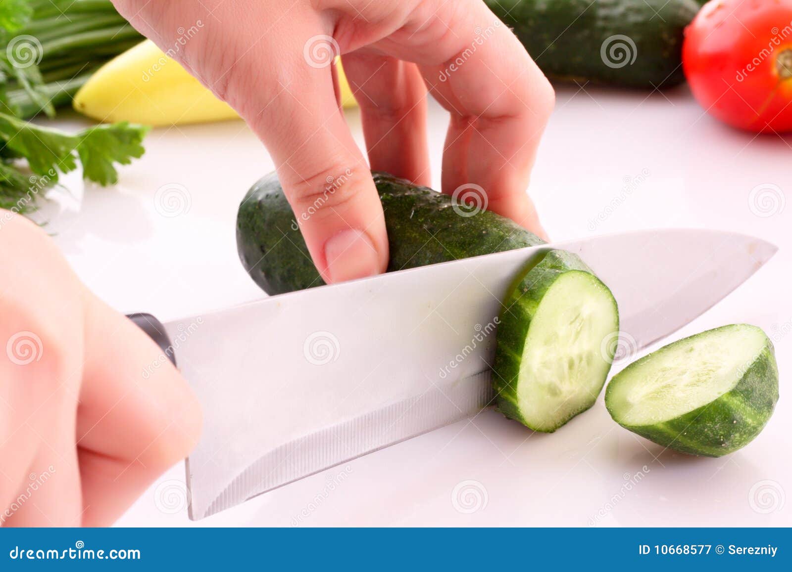 Someone cutting a cucumber stock image. Image of slice - 10668577