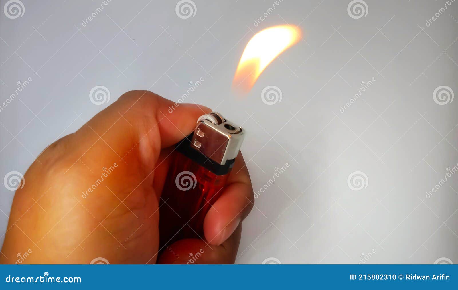 Someone is lighting a fire stock photo. Image of equipment - 215802310