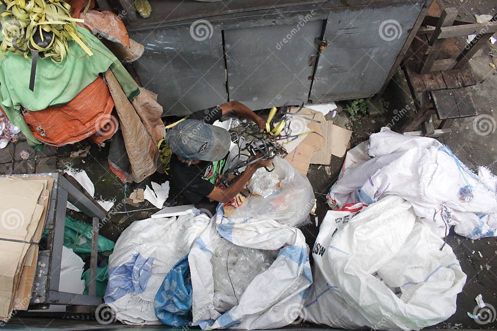 Humans and Garbage editorial stock photo. Image of iron - 278120403