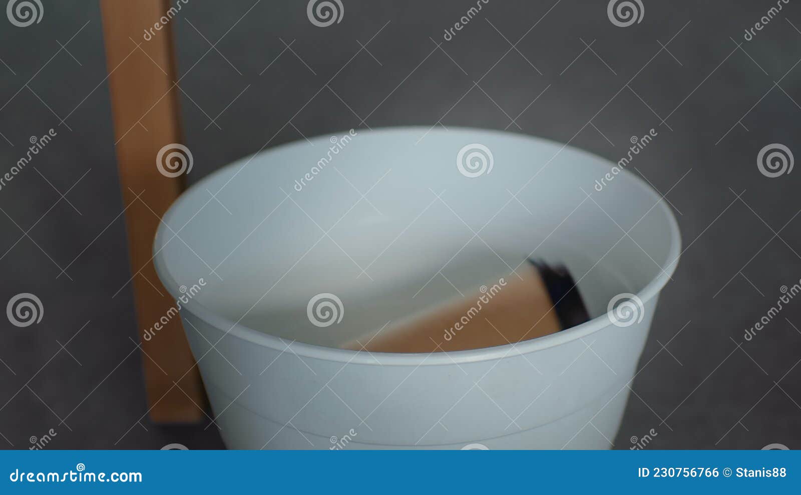 Someone Throws an Empty Paper Cup of Coffee in the Trash in the Office ...