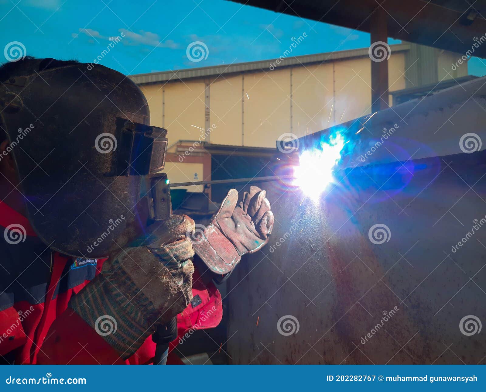 Someone is Welding a Trash Can Made of Iron Stock Image - Image of ...