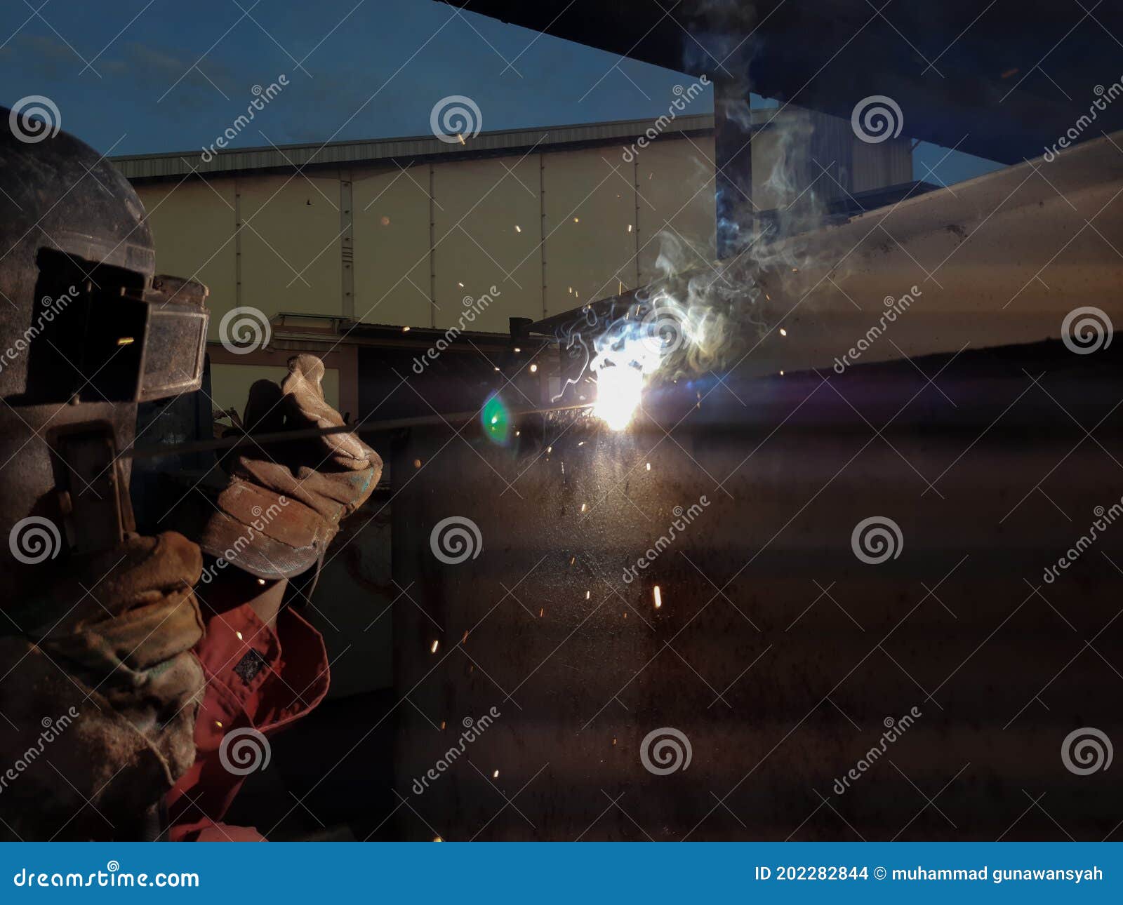 Someone is Welding a Trash Can Made of Iron Stock Photo - Image of ...