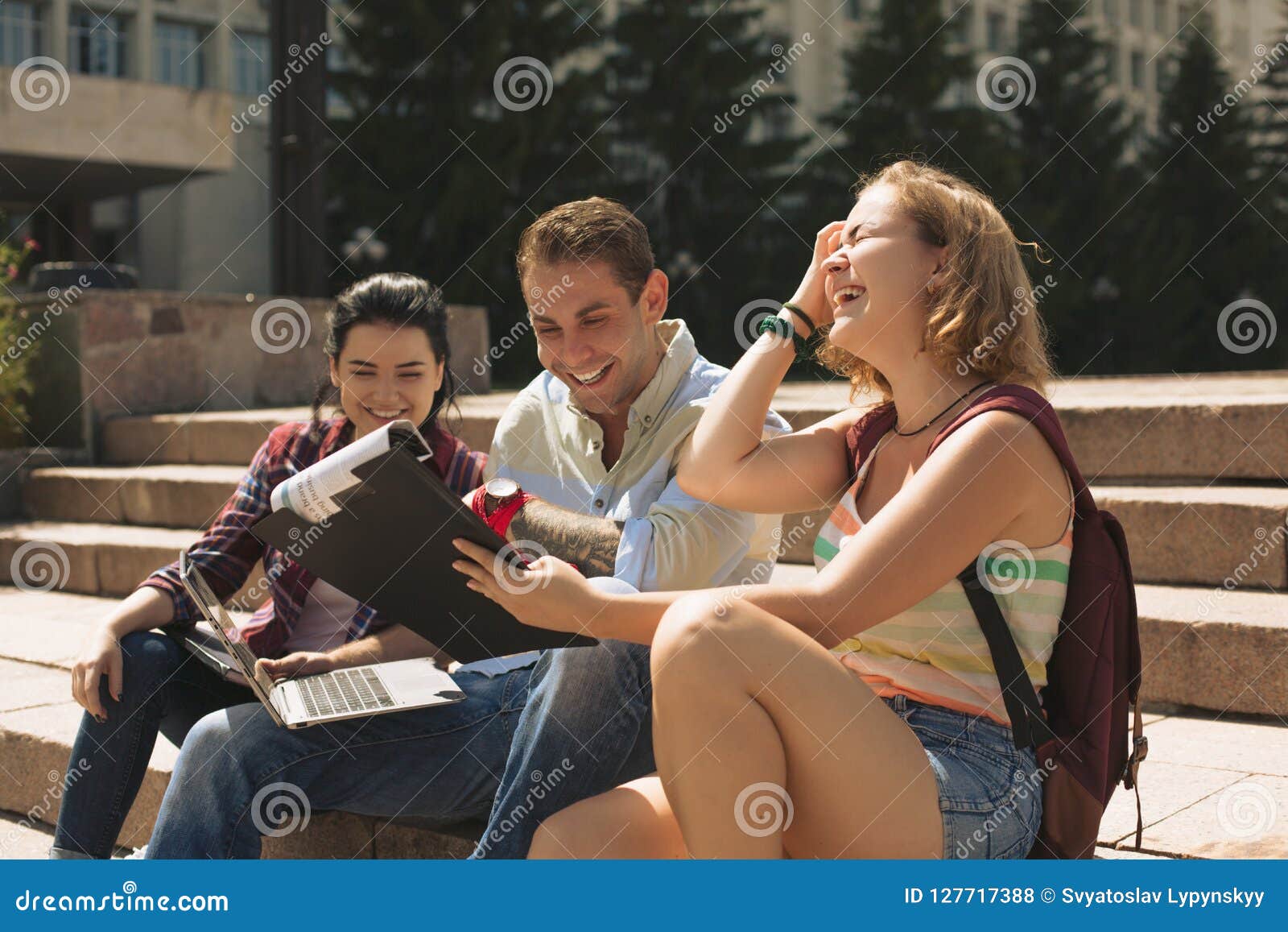 Group of Three Students Sitting on Stairs Stock Photo - Image of ...