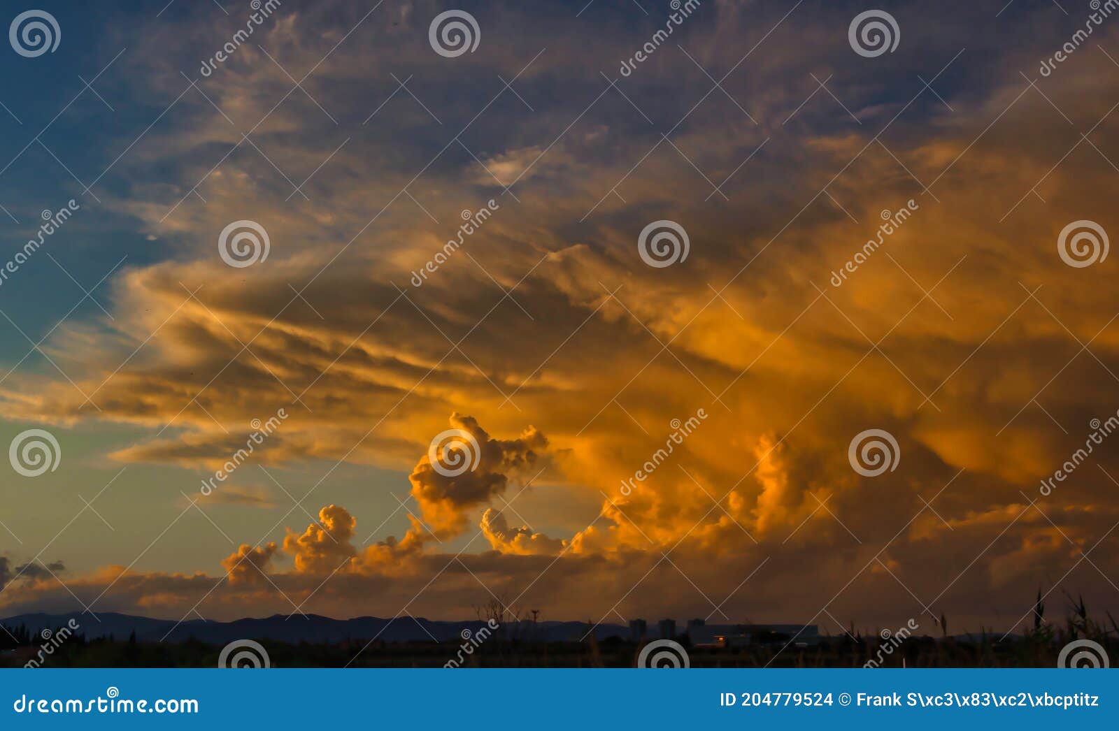 Dynamic Cloud Formation in the Setting Sun Stock Photo - Image of light ...