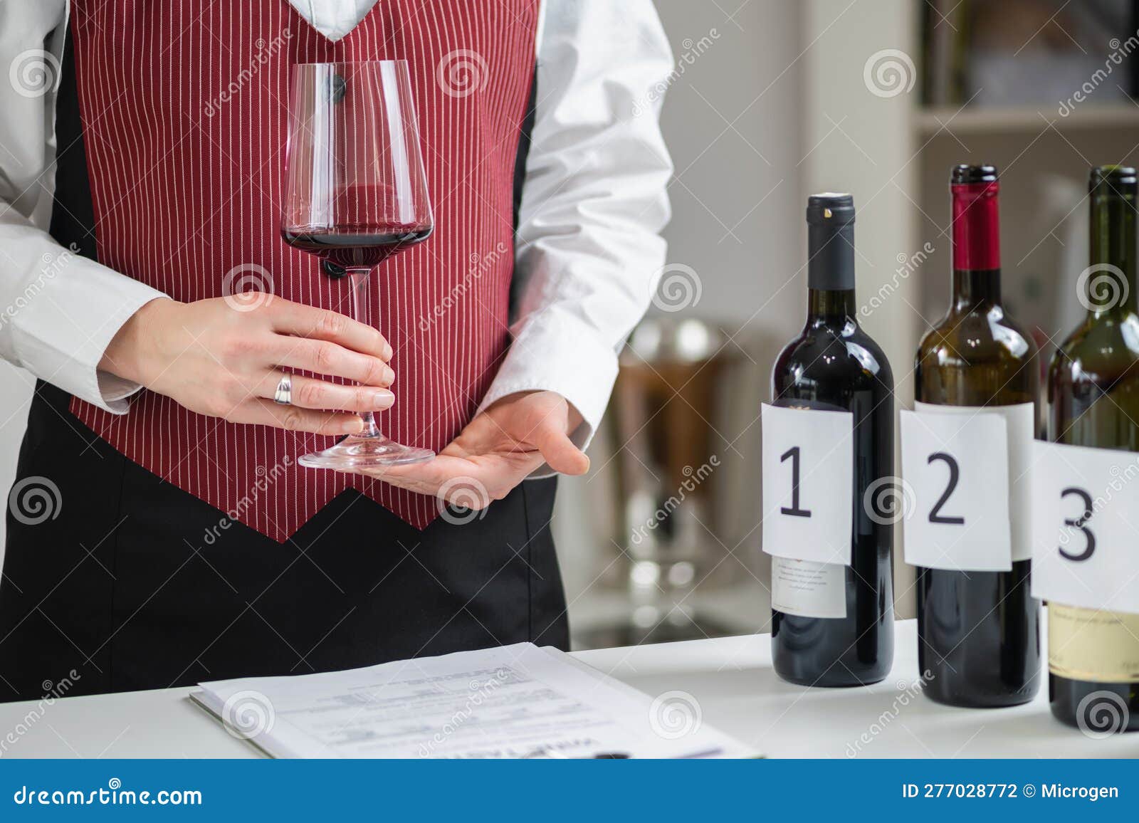 Sommelier Holding a Glass of Red Wine Stock Photo - Image of techniques ...