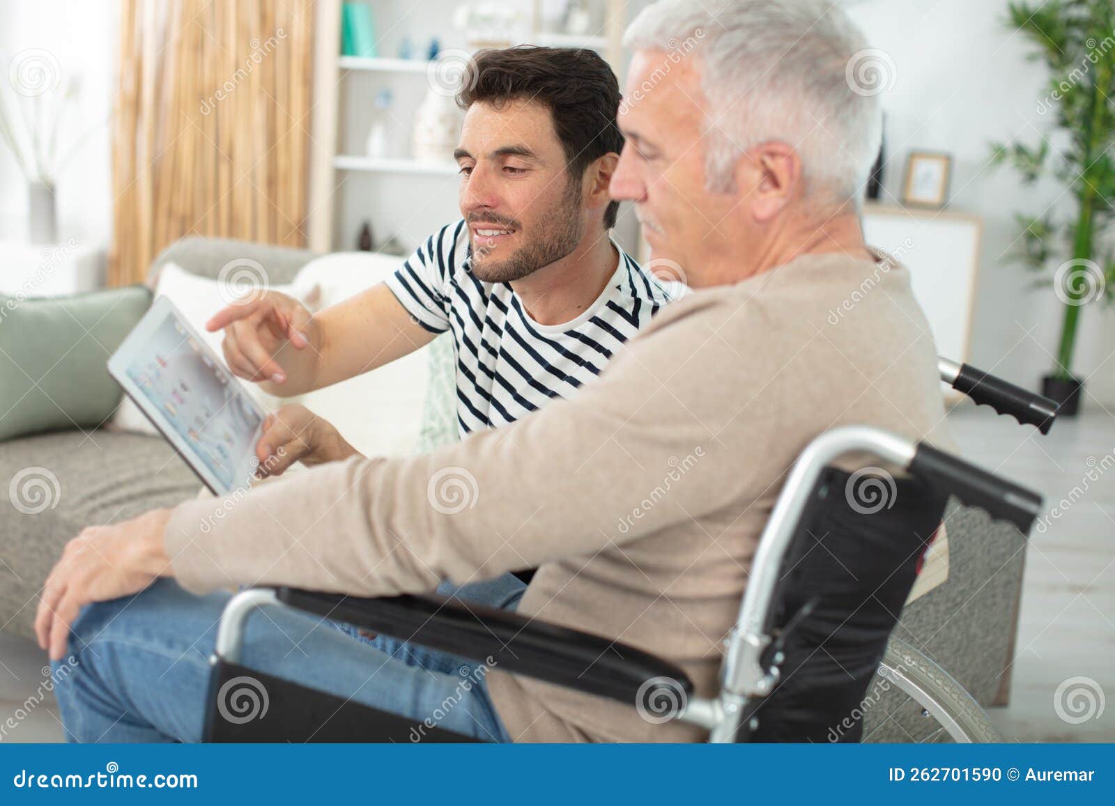 Son Helping Dad with Tablet Stock Photo - Image of show, family: 262701590