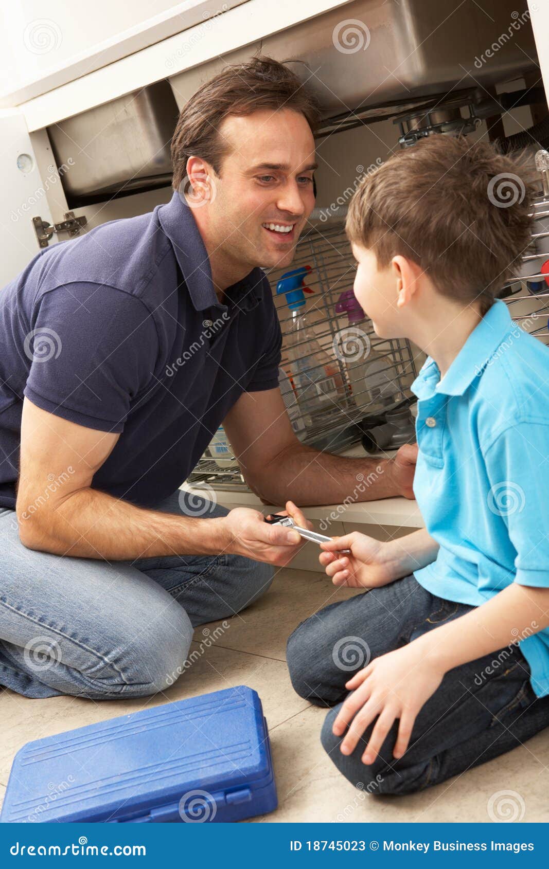 Boy Helping His Father Placing A Ceramic Floor Tile Stock Image ...