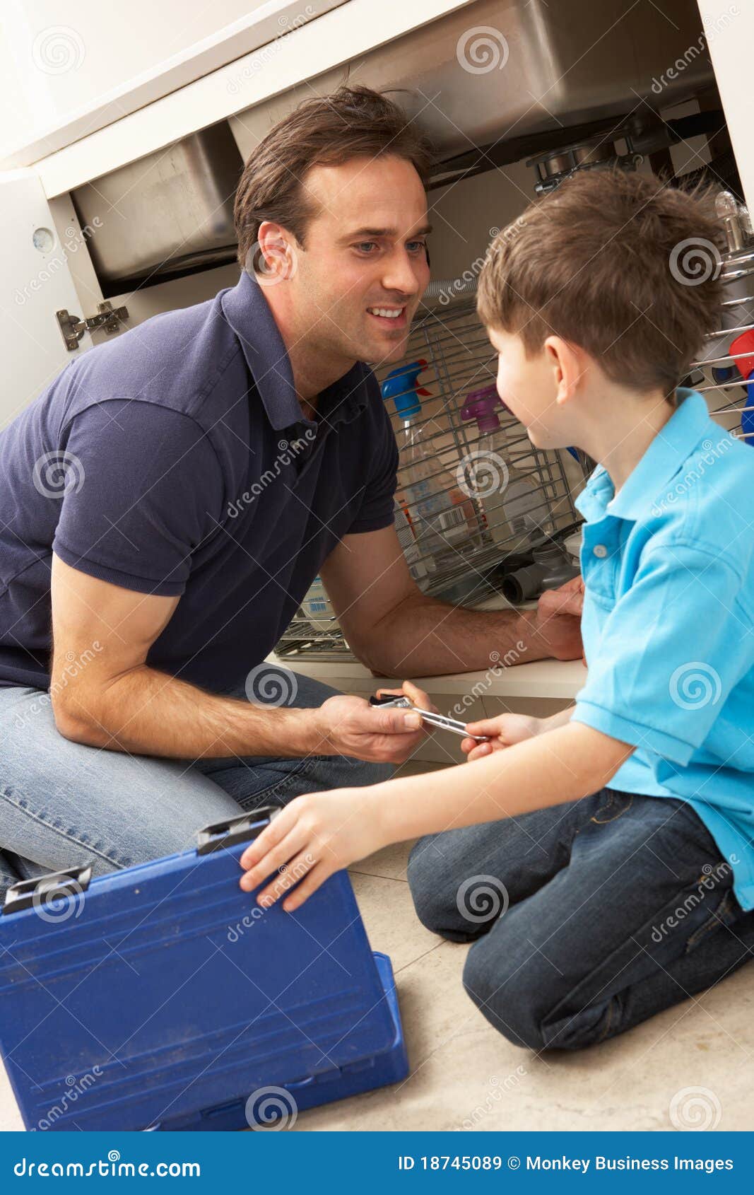 Boy Helping His Father Placing A Ceramic Floor Tile Stock Image ...