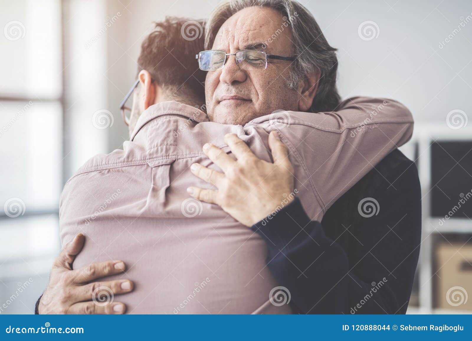Son hugs his own father stock photo. Image of parent - 120888044