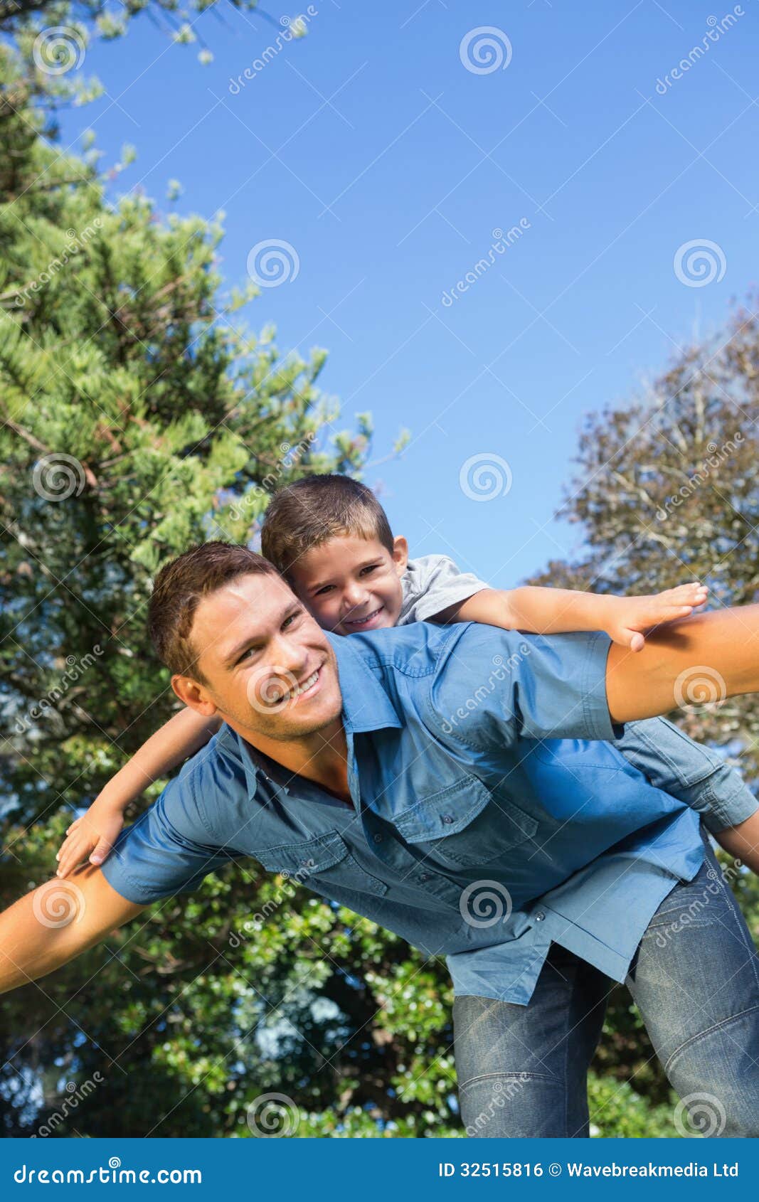 Son Lying on His Fathers Back Stock Photo - Image of messing, carrying ...