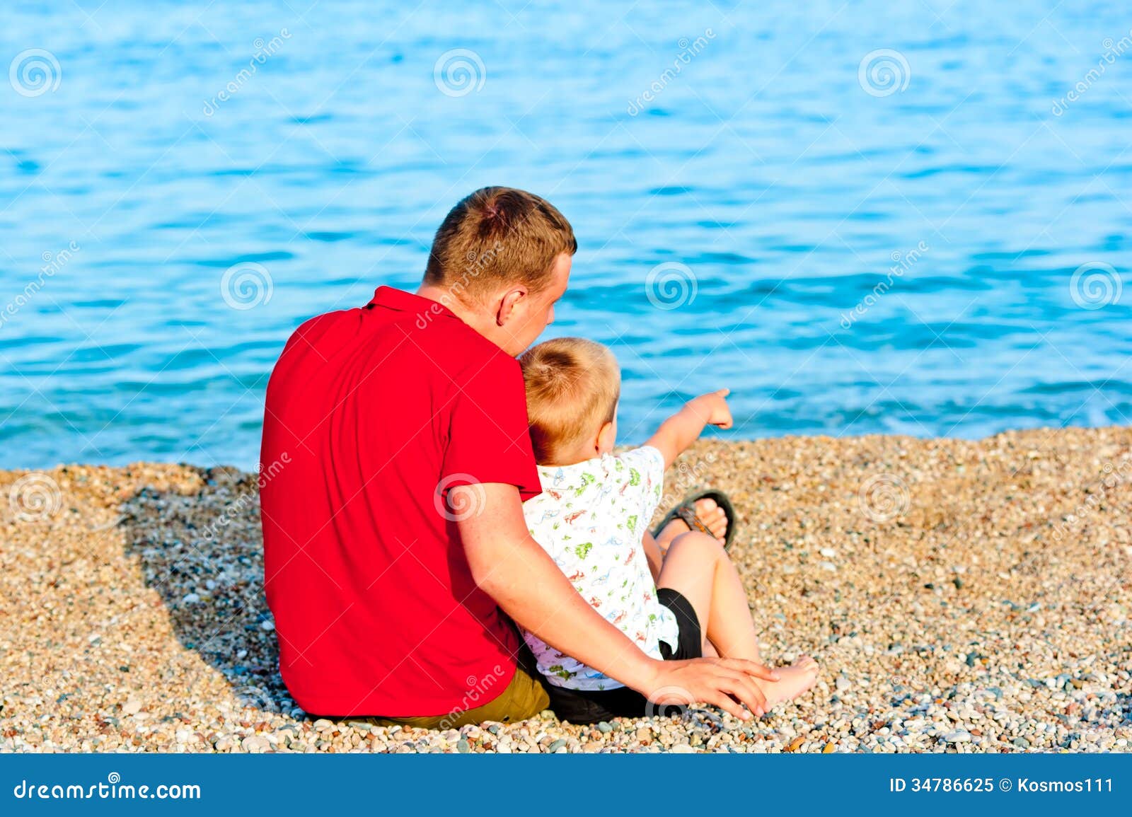 Son Reveals that His Father is in the Sea, they are Sitting Stock Image ...
