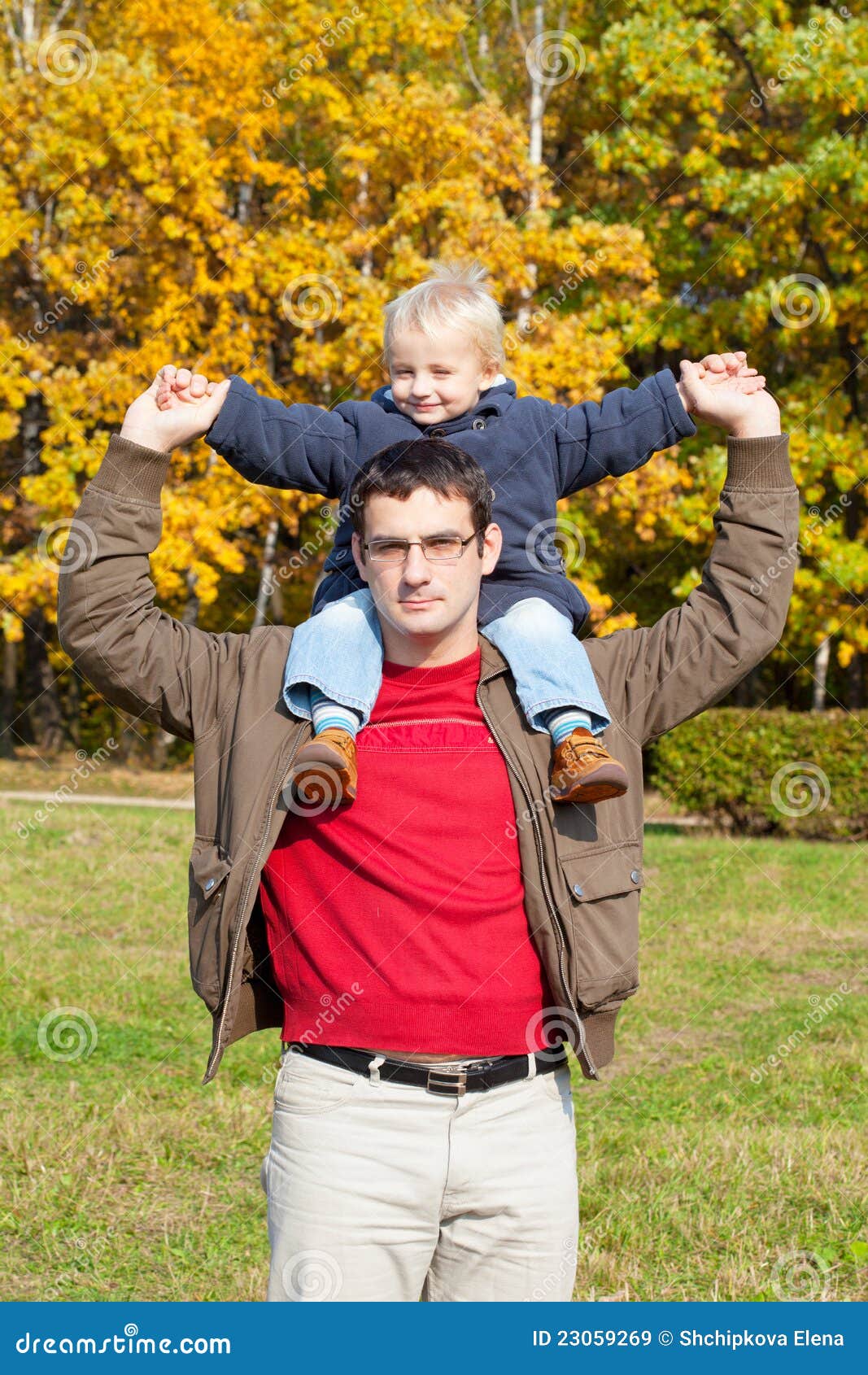Son Sits on Shoulders at the Father Stock Image - Image of yellow ...