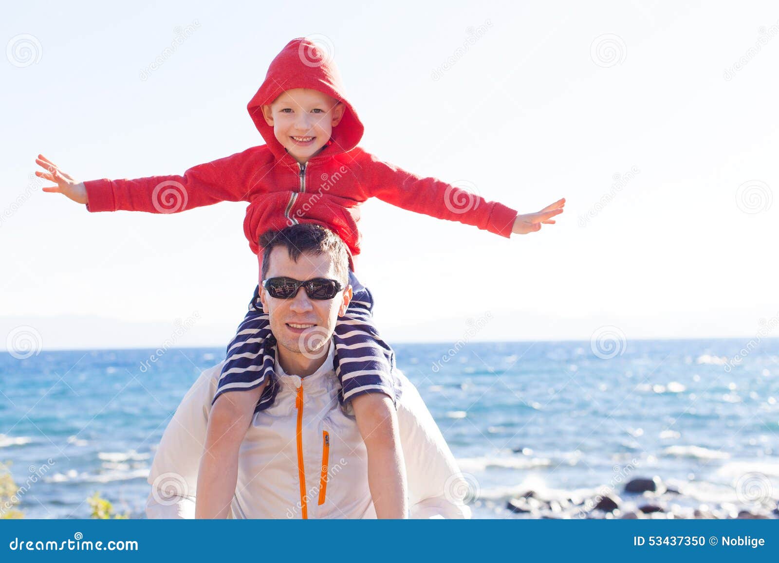 Son Sitting on Father S Shoulders Stock Photo - Image of children ...