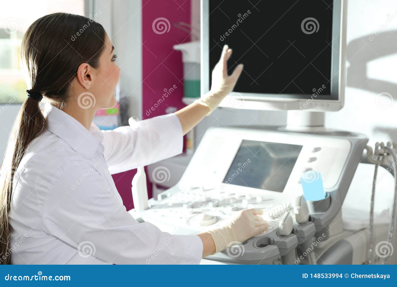 Sonographer Using Ultrasound Machine in Clinic Stock Photo - Image of ...