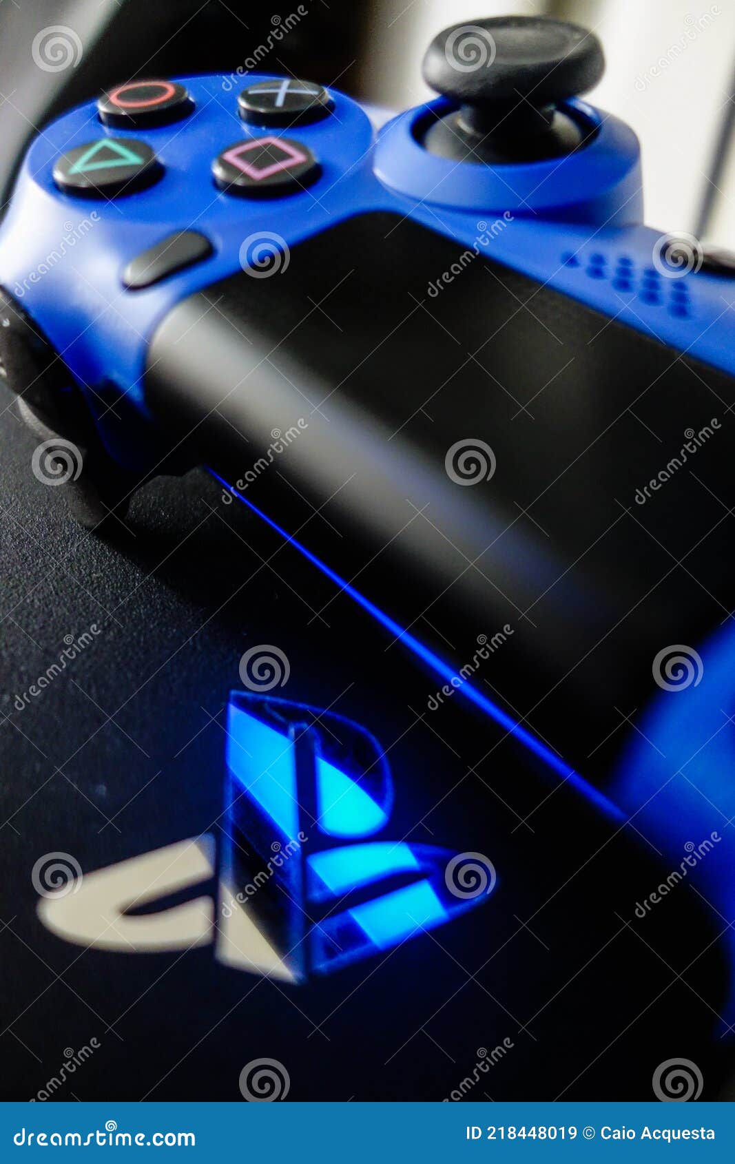 Sony Playstation Logo Illuminated on Blue Light from Game Controller ...