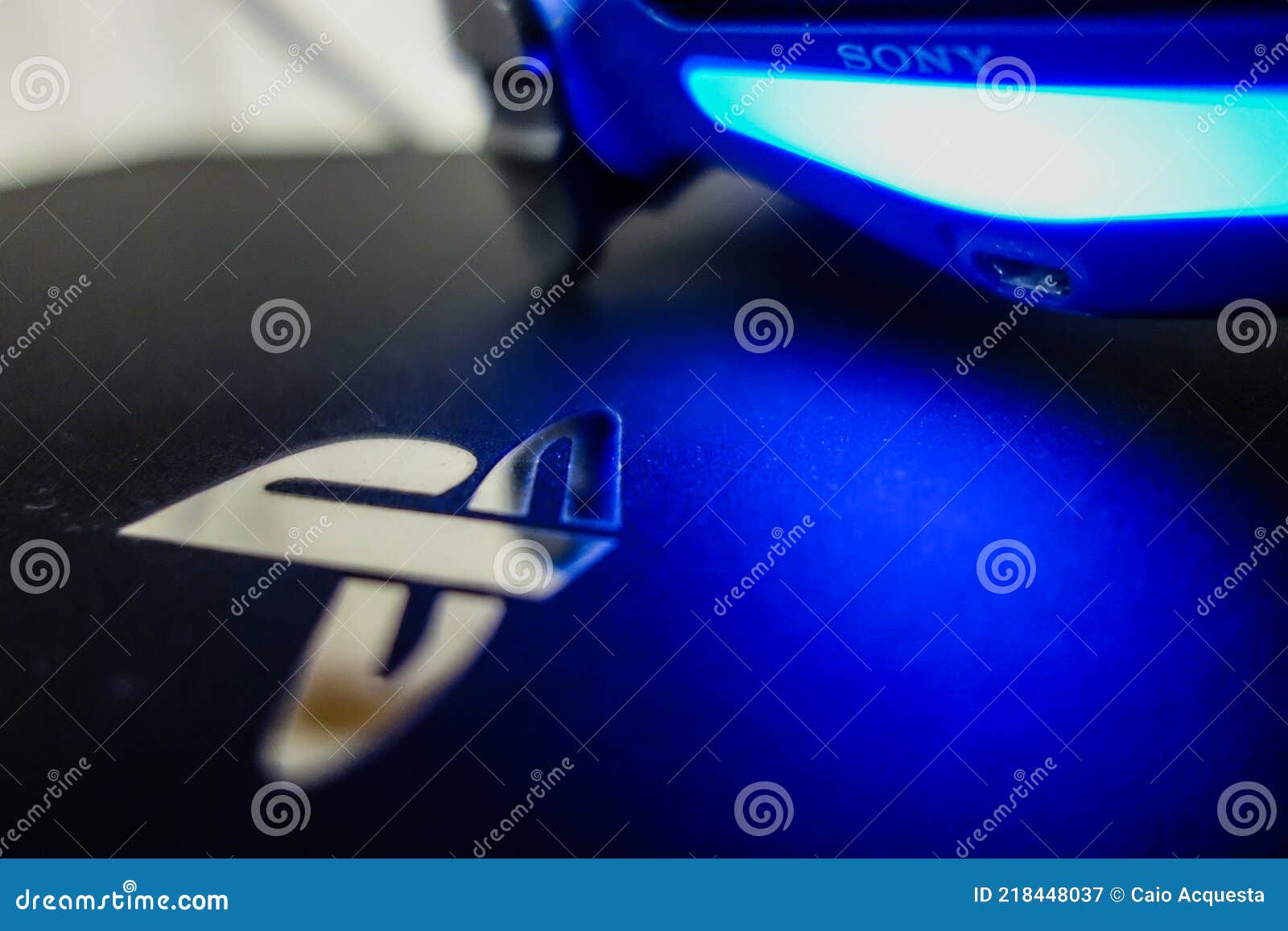 Sony Playstation Logo Illuminated on Blue Light from Game Controller ...