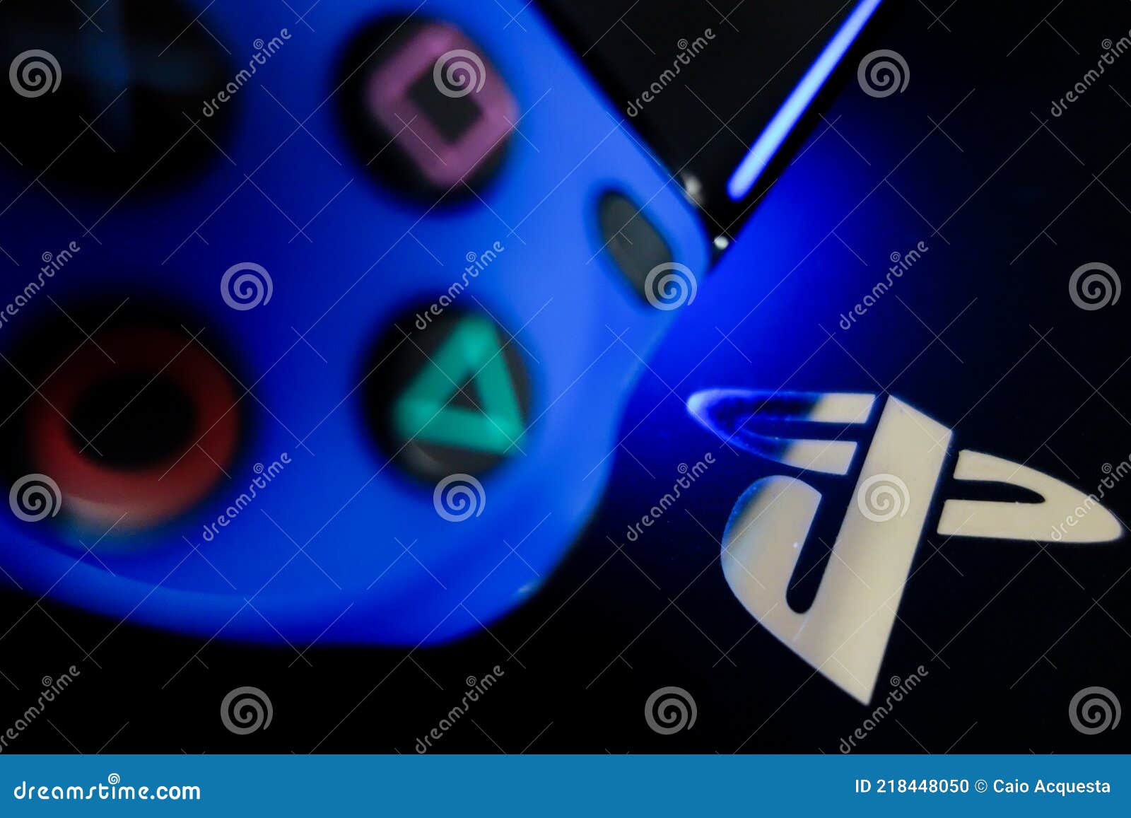 Sony Playstation Logo Illuminated on Blue Light from Game Controller ...