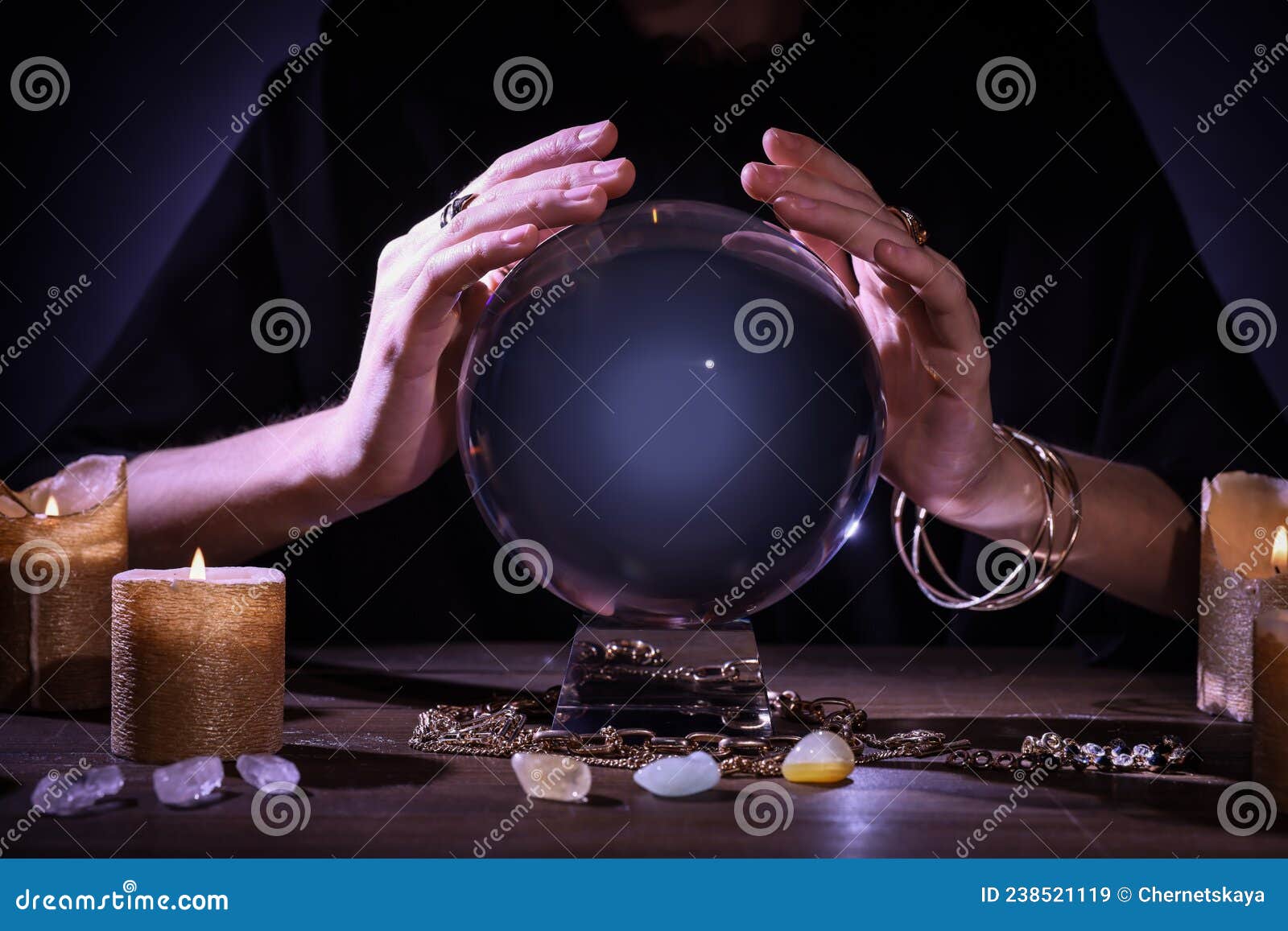 Soothsayer Using Crystal Ball To Predict Future At Table In Darkness