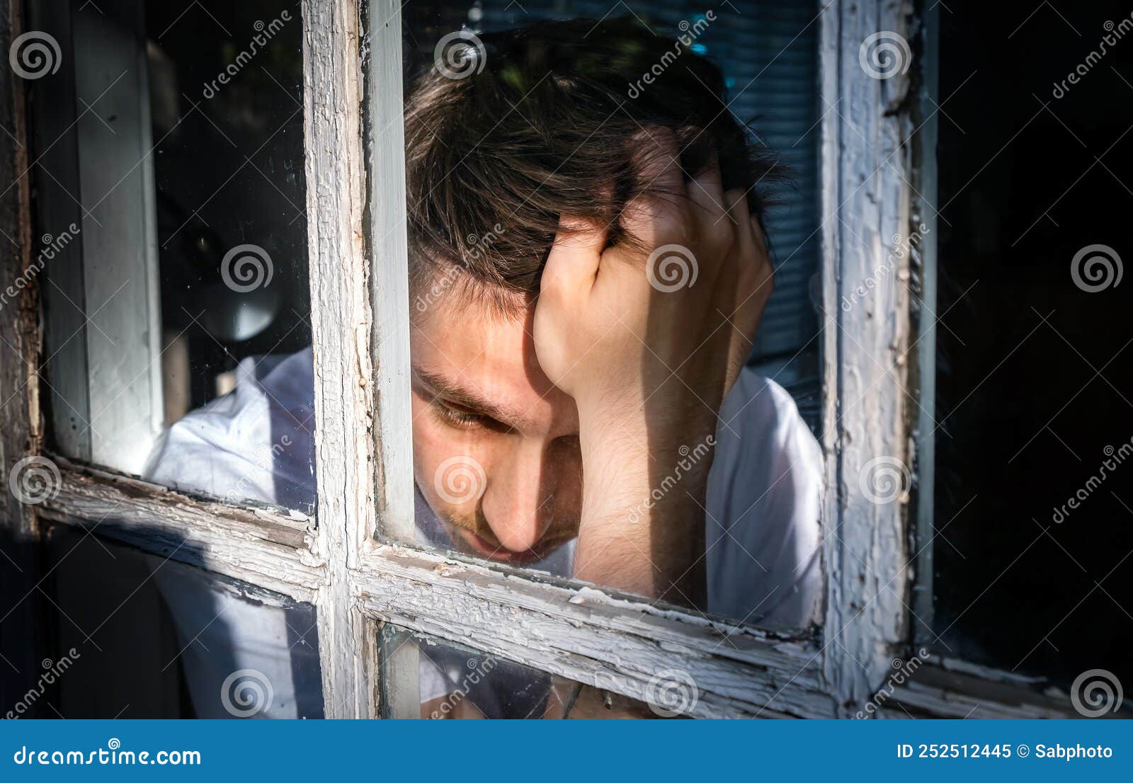 Sad Young Man stock image. Image of mourning, indoor - 252512445