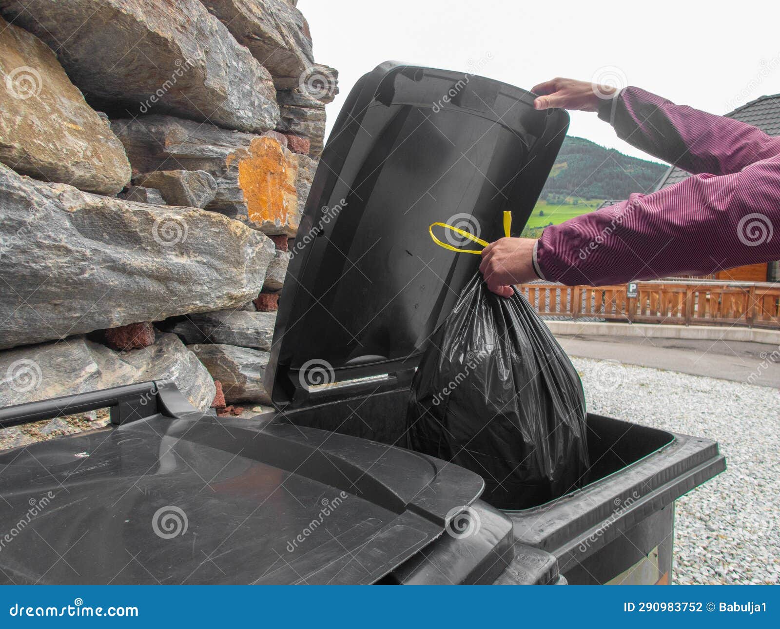 Sorted Garbage.Garbage in a Black Plastic Bag. Hand Lowers a Black Bag ...