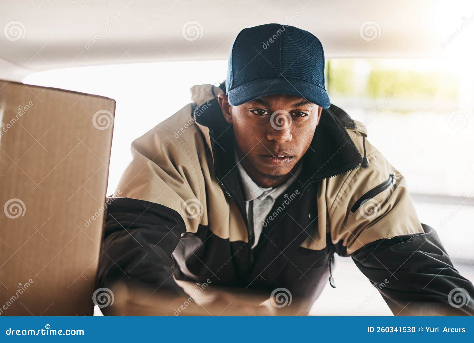Sorting through All the Boxes. a Courier Sorting Boxes in a Delivery ...