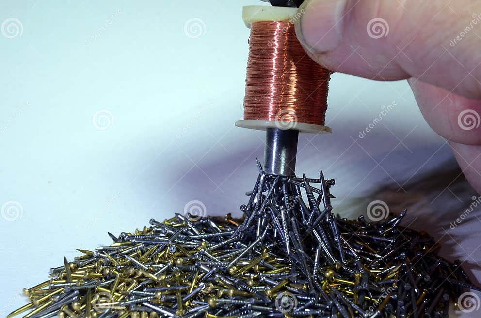 Sorting iron from brass stock image. Image of school - 104549351