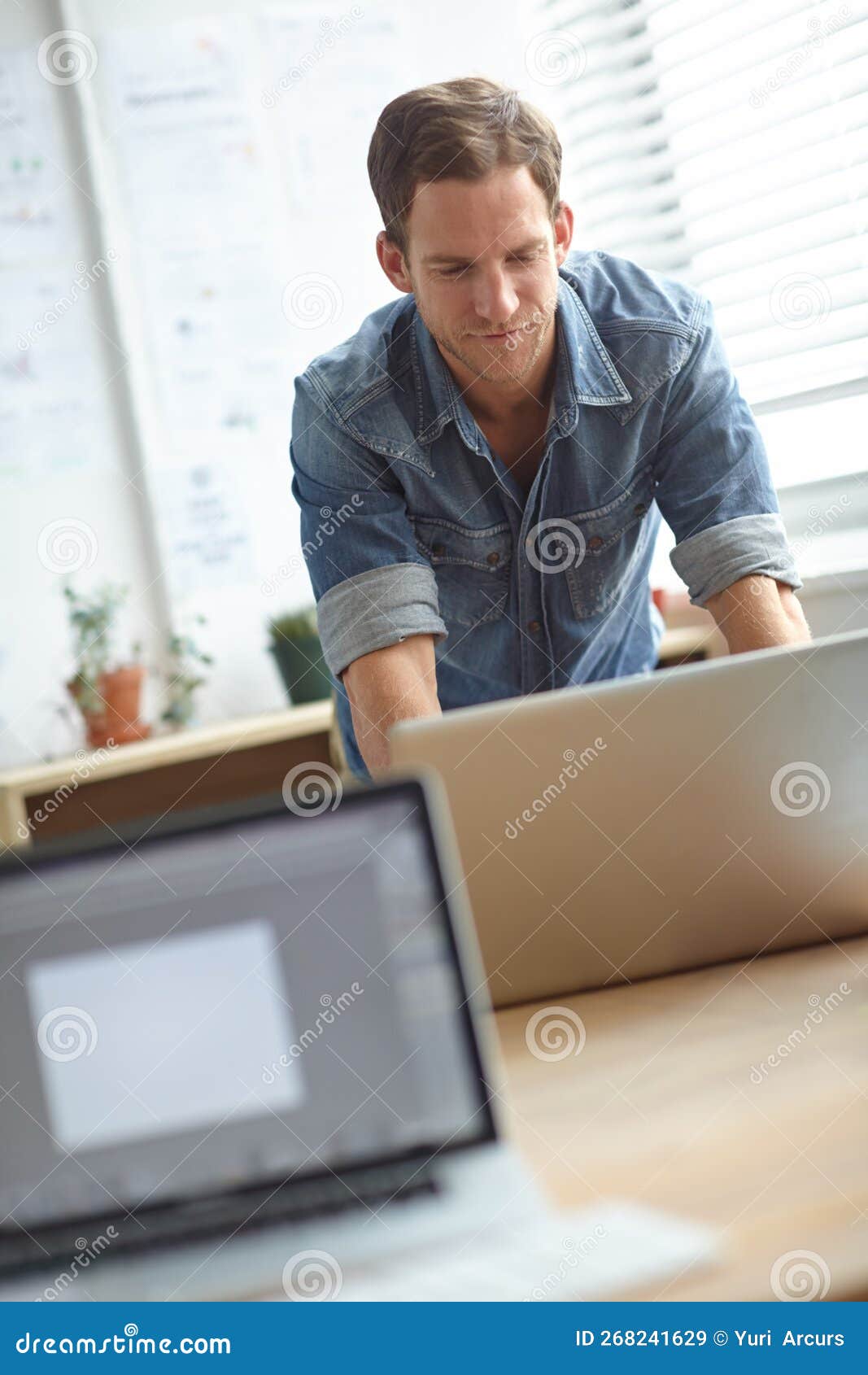 Sorting Out Their Internet Problems. a Handsome Young Man Working on ...