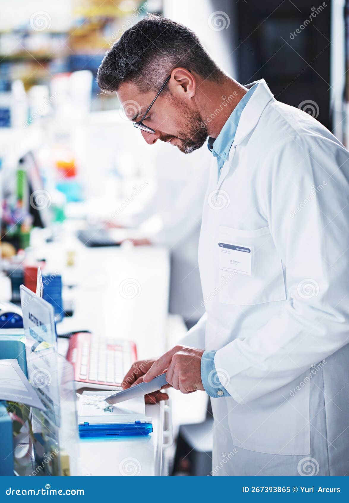 Sorting and Processing Different Pills. a Mature Pharmacist Sorting ...