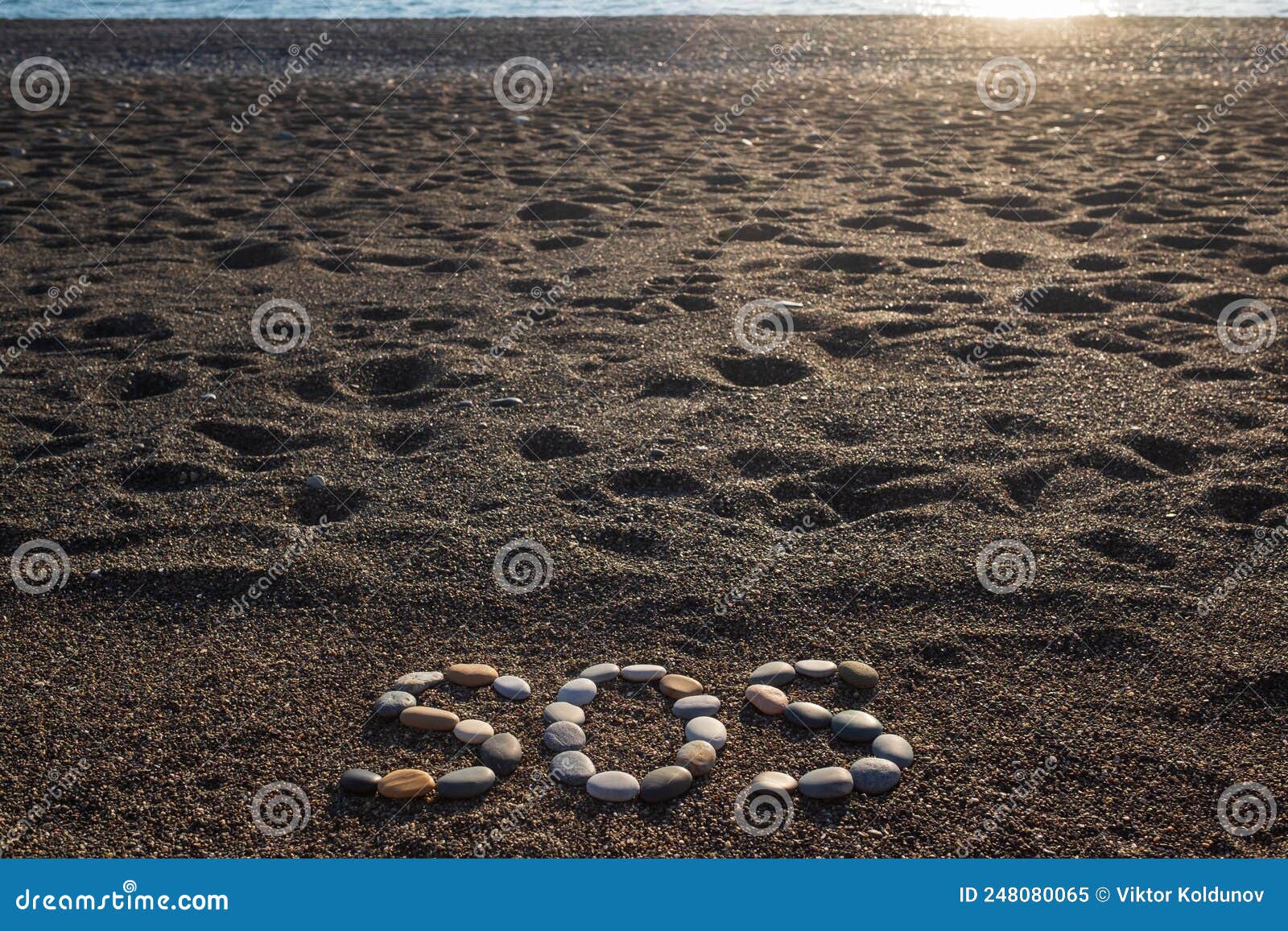 SOS Message Made with Stones on the Beach Stock Image - Image of coast ...