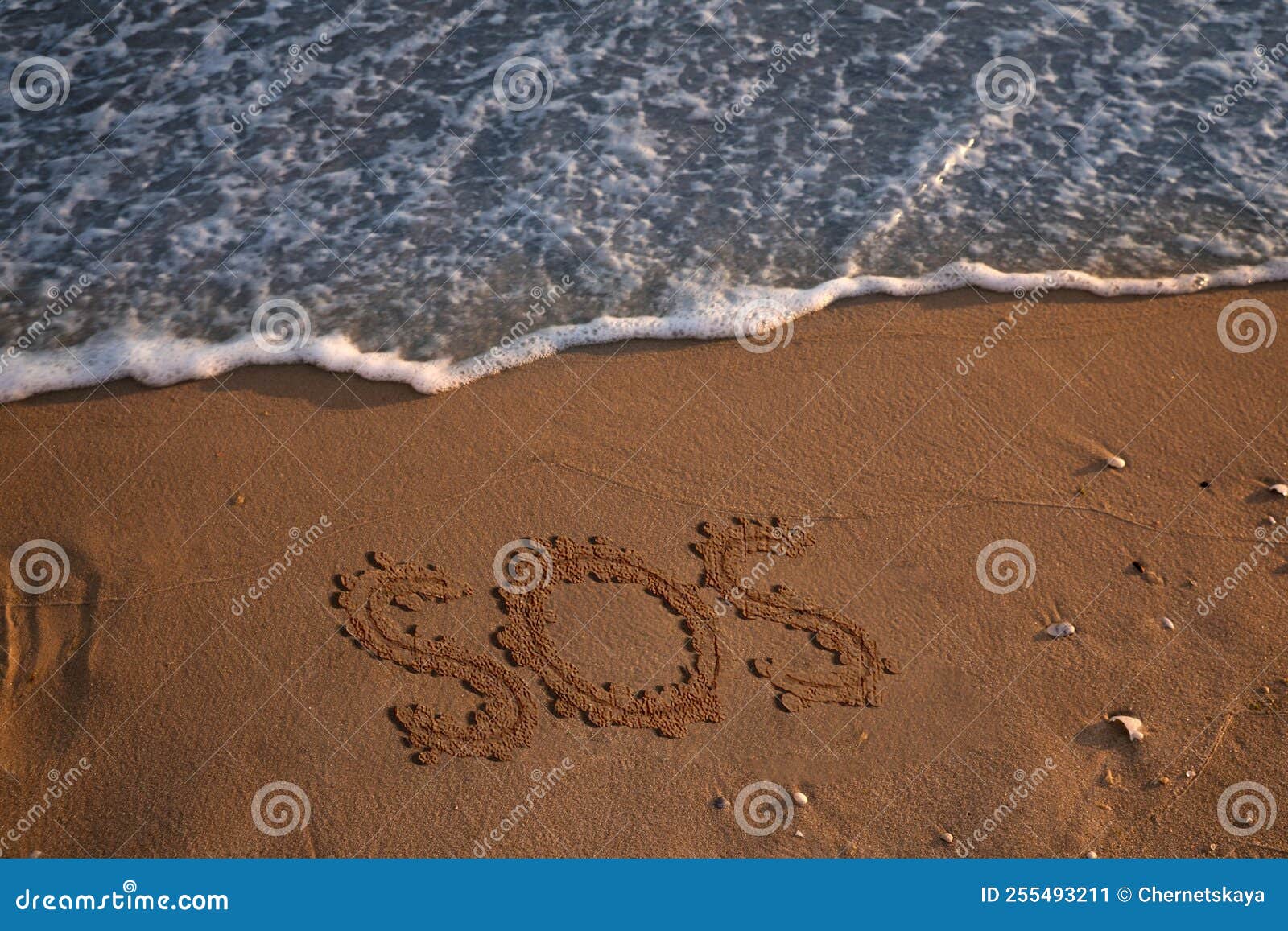 SOS Message Drawn on Sandy Beach Near Sea, Above View Stock Image ...