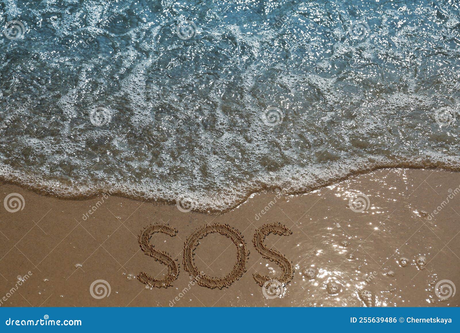 SOS Message Drawn on Sandy Beach Near Sea, Above View Stock Photo ...
