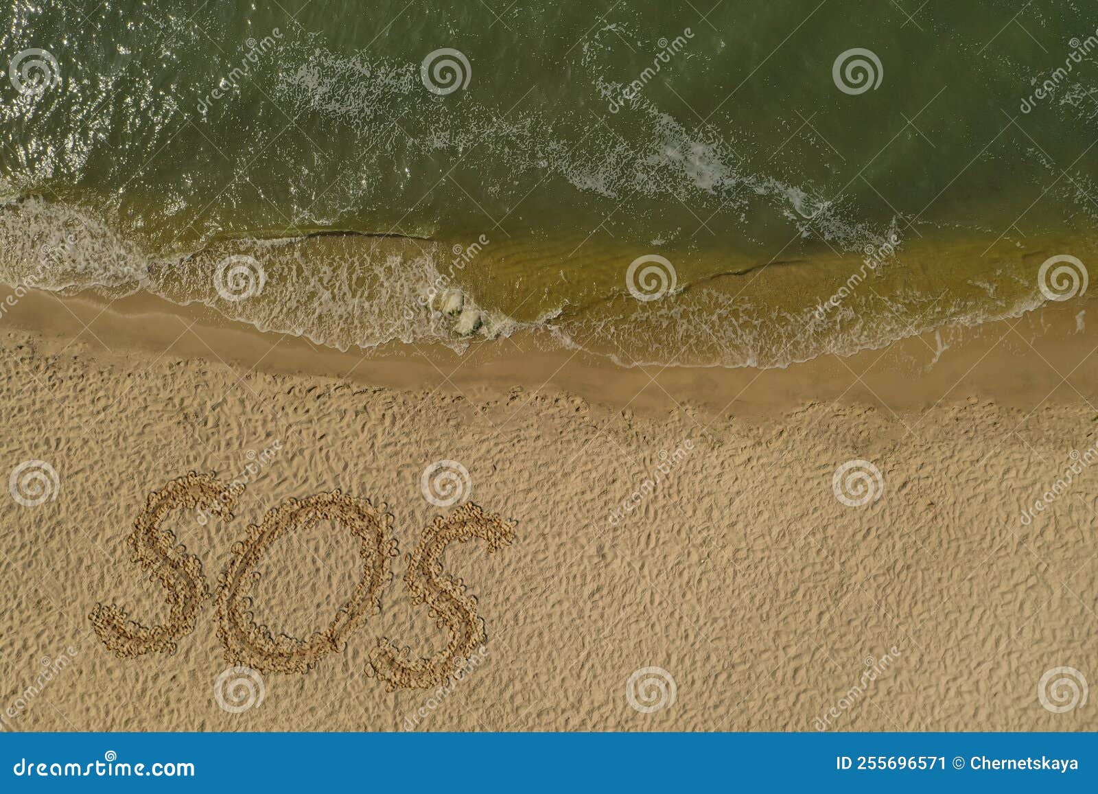 SOS Message Drawn on Sandy Beach Near Sea, Above View Stock Image ...