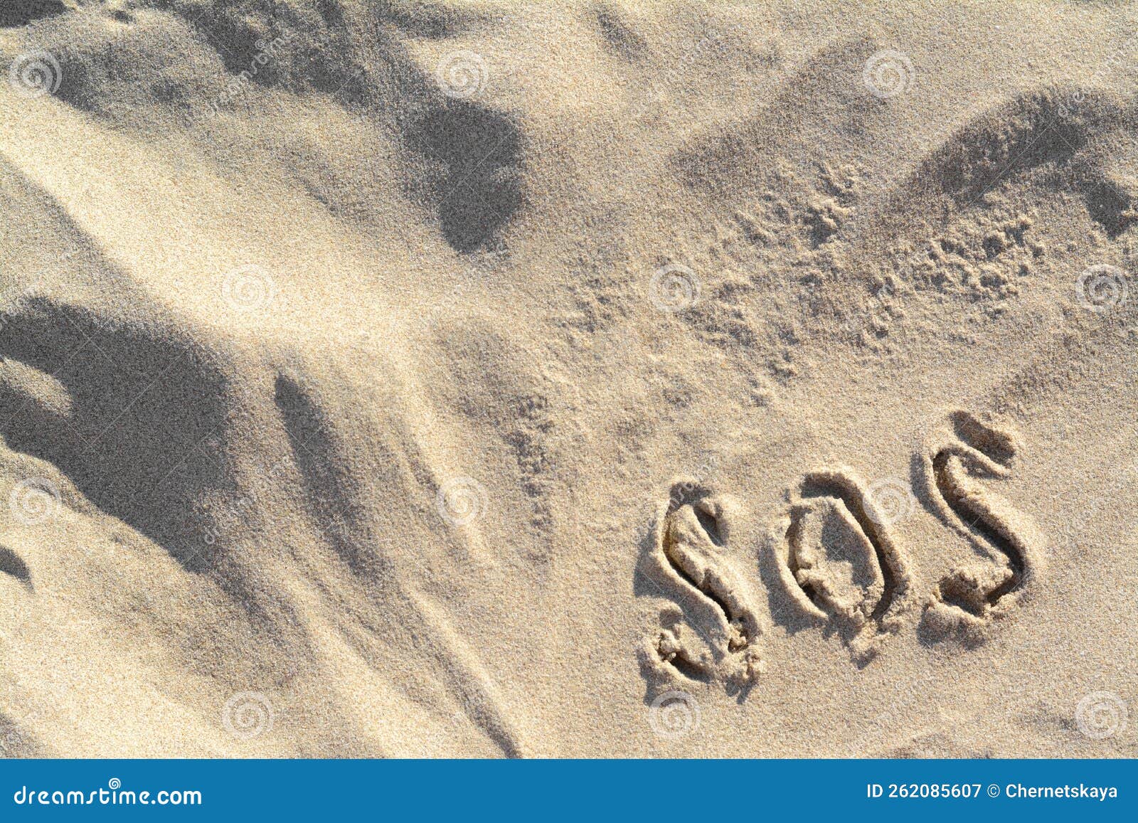 SOS Message Written on Sandy Beach Outdoors, Top View. Space for Text ...