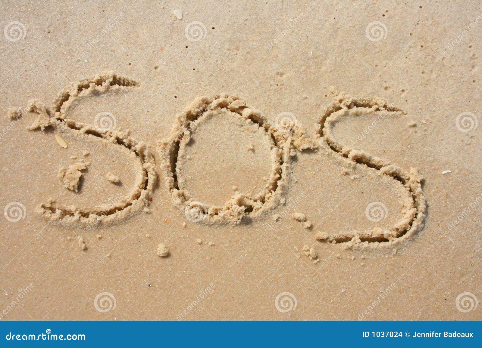 SOS in the sand stock photo. Image of easy, written, spelled - 1037024