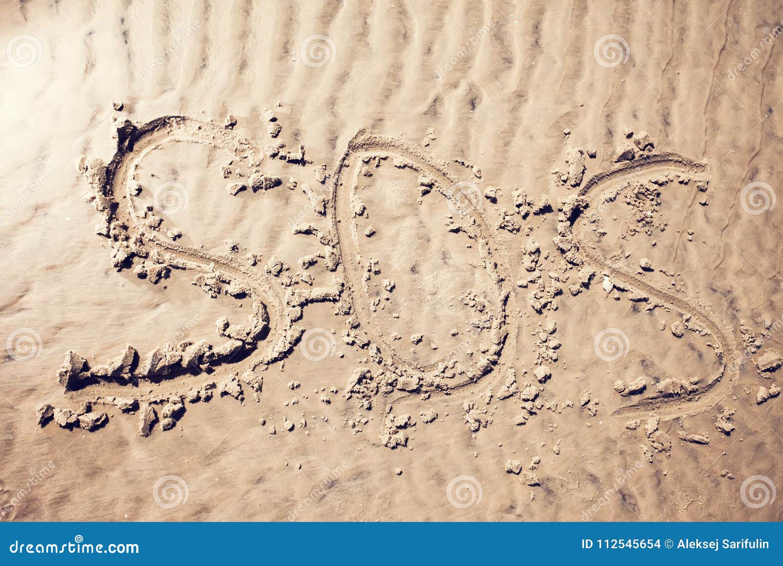 Sos sign write on sand stock photo. Image of sand, message - 112545654