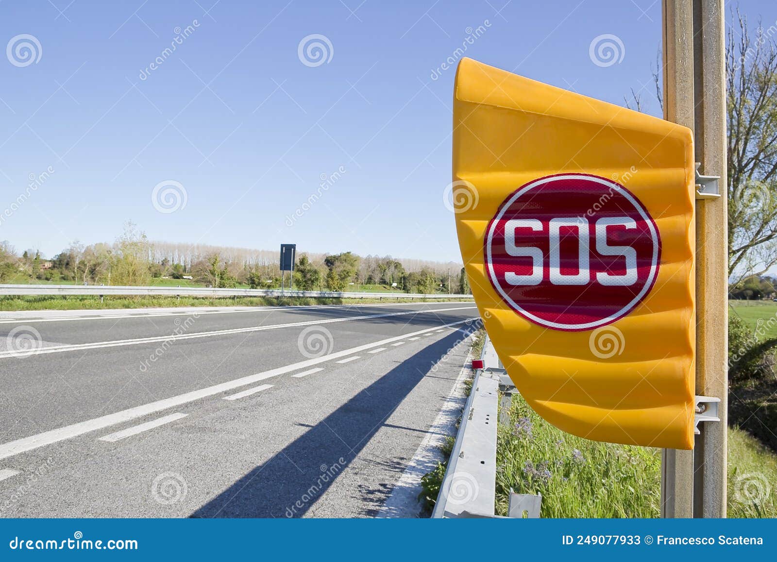 SOS Sign on Yellow Plastic Phone Box on Highway Stock Image - Image of ...