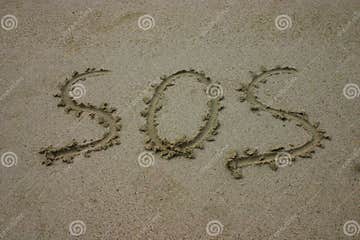 SOS written in sand stock photo. Image of ocean, help - 20136350